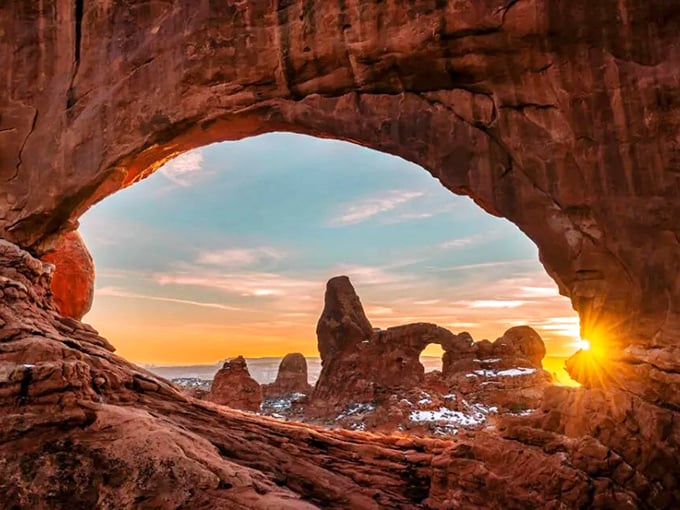 Through the Window Arch at sunset, where the golden hour takes on new meaning and makes professional photographers weep with joy.