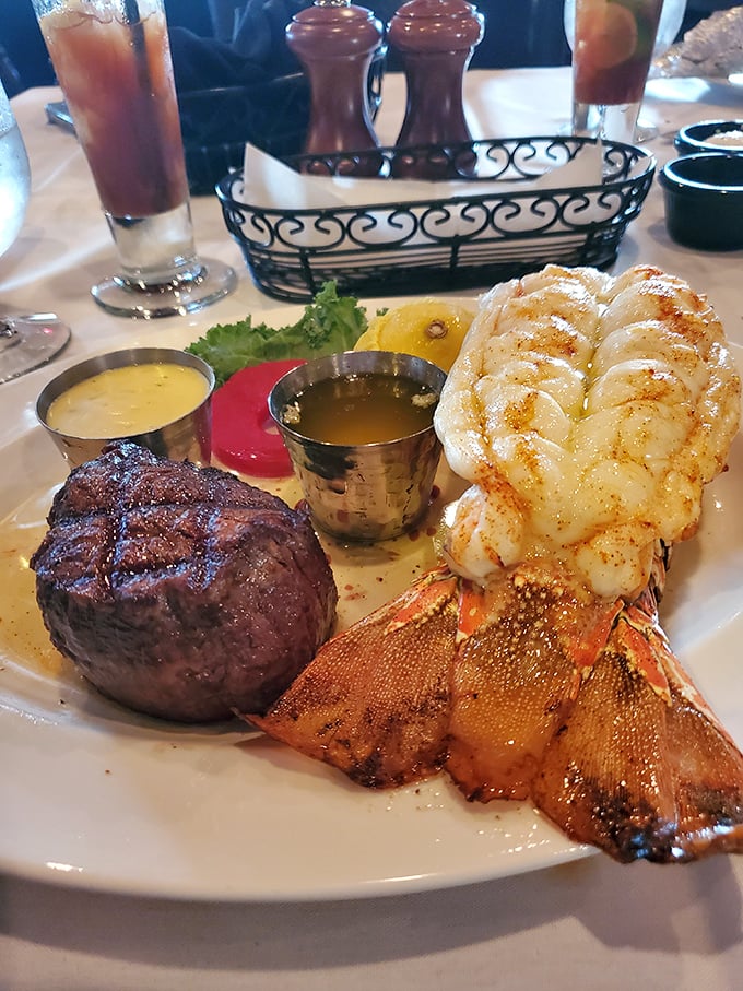 The surf and turf that launched a thousand food photos. That lobster tail isn't just dinner—it's an event with its own gravitational pull.