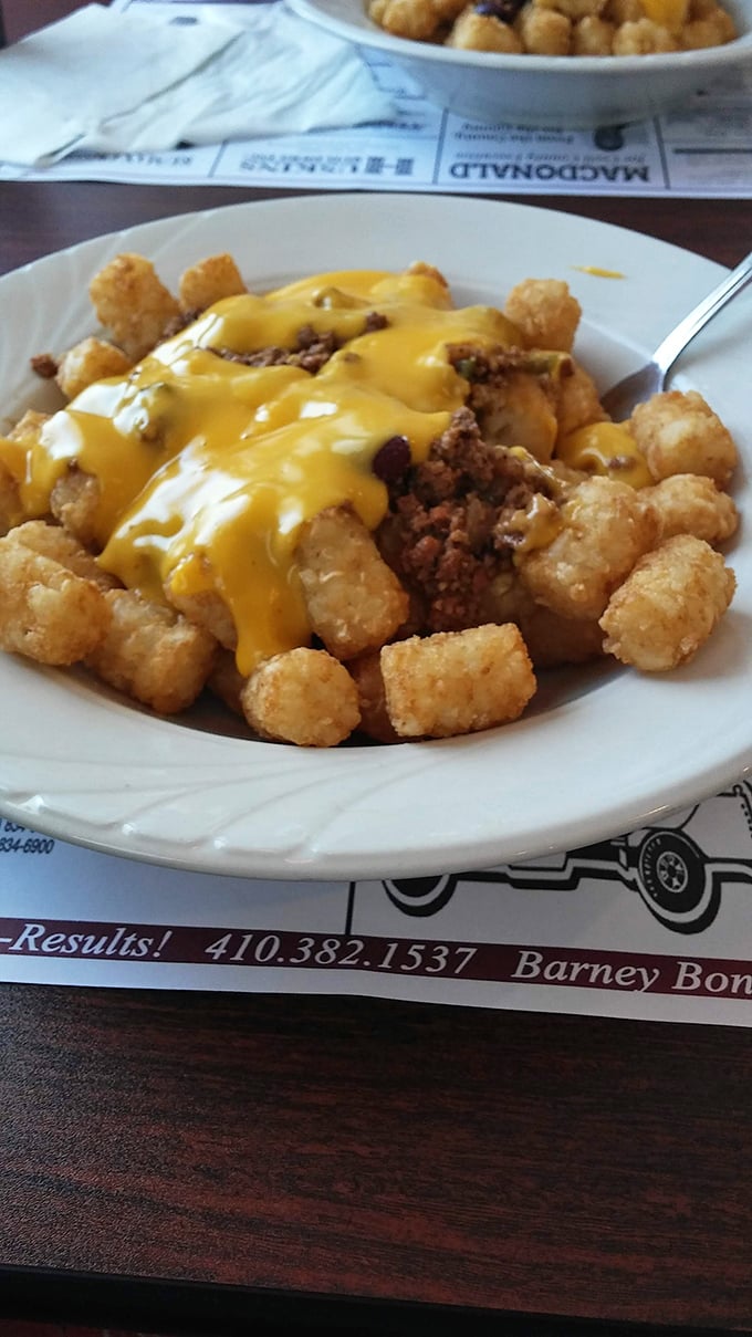 Tater tots smothered in chili and cheese &ndash; childhood nostalgia meets adult indulgence in a dish that requires no permission slip to enjoy.