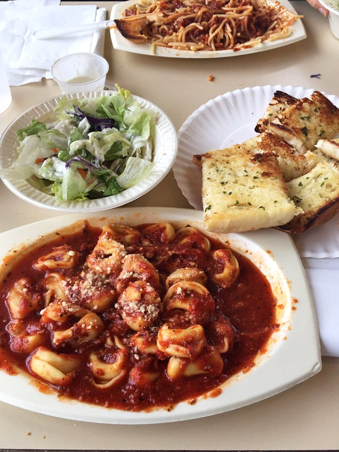 Tortellini swimming in that signature red sauce, garden-fresh salad, and golden garlic bread&mdash;the kind of meal that ruins diets but creates memories.