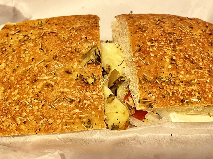 Herb-flecked focaccia cradling a treasure of ingredients. The kind of sandwich that makes you wonder why you ever settled for drive-thru options.