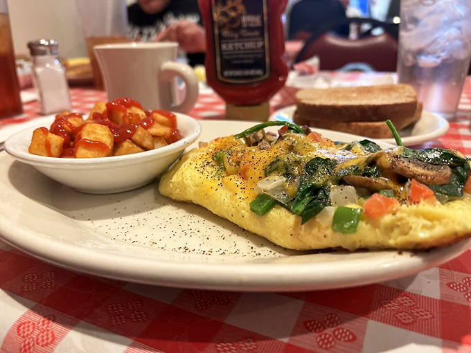 This veggie omelet and home fries combo proves that vegetables can party too, especially when invited to a breakfast celebration.