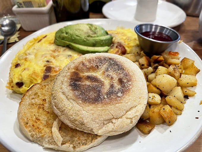 Breakfast architecture at its finest&mdash;a perfectly cooked English muffin foundation supporting this protein-packed masterpiece. The avocado adds that California dreaming touch.