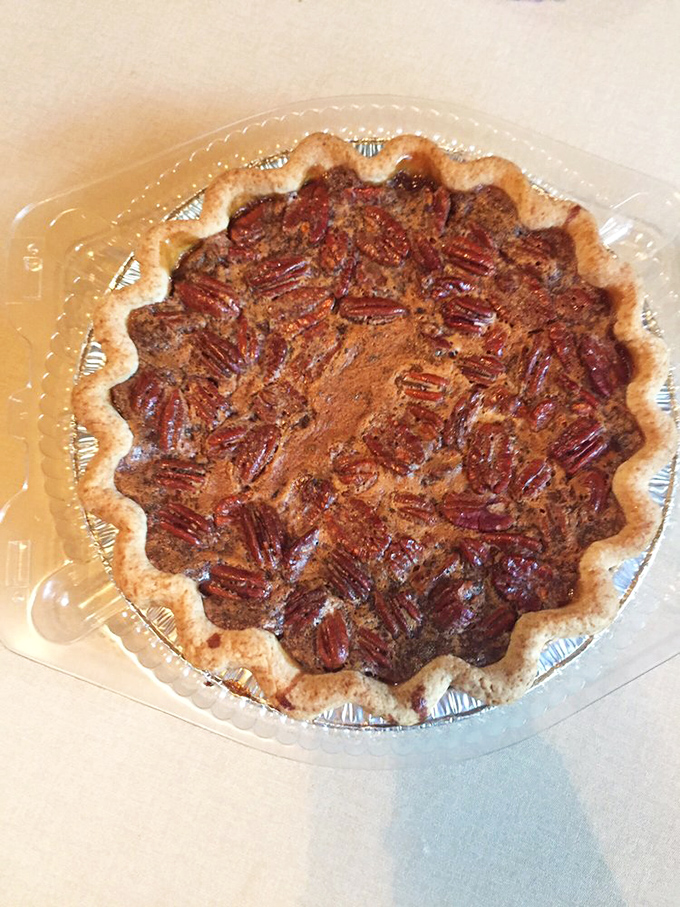 A whole pecan pie that deserves its own security detail. The crimped edges are like the fancy necklace this beauty deserves to wear.
