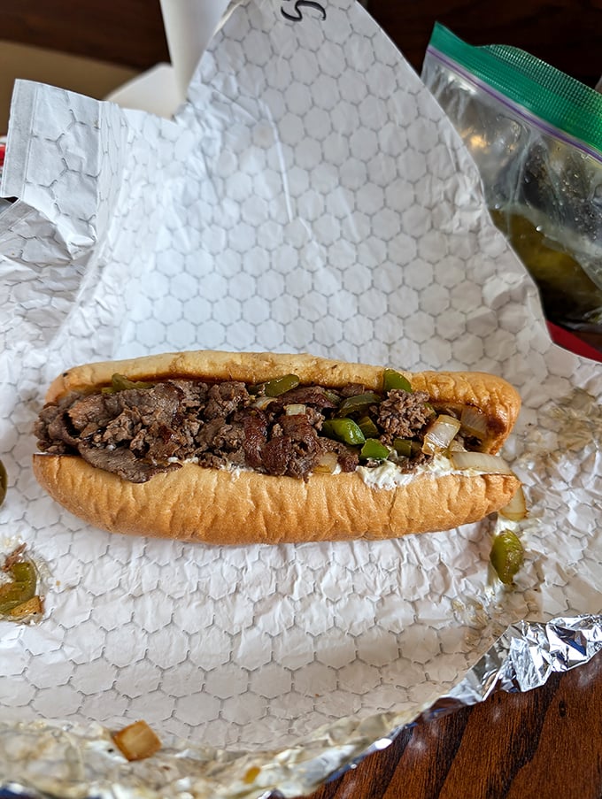 The holy trinity of meat, cheese, and peppers creates a symphony of flavors that makes you wonder why you'd ever order anything else.