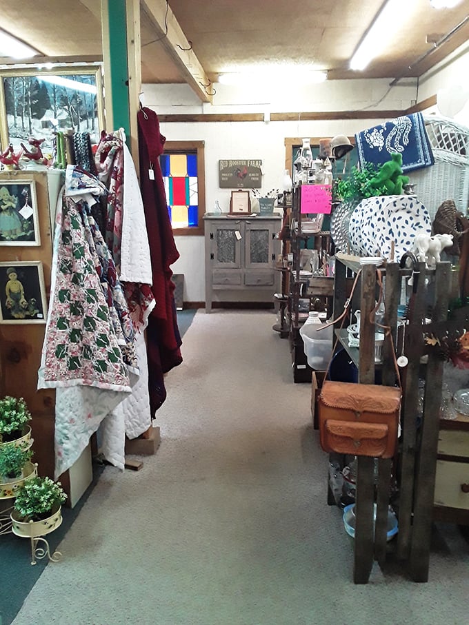 Vintage textiles and weathered furniture create a pathway through someone else's memories. Each booth feels like stepping into a different decade's attic sale.