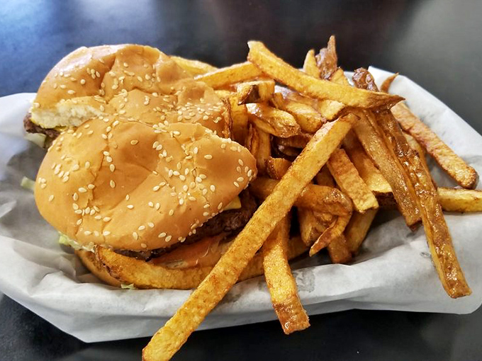 The classic bacon cheeseburger, presented without pretense but with plenty of promise. That special sauce container is practically begging to be opened. 