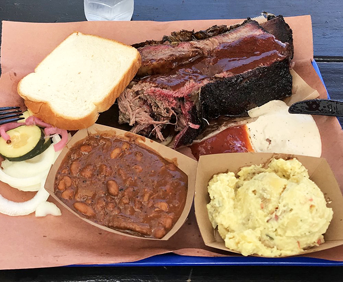Wrapped like a present in foil, this brisket has been on a slow, smoky journey to perfection. The patience required rivals waiting for the final season of your favorite show.
