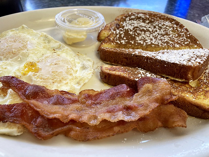 French toast dusted with powdered sugar like the first snow of winter—a breakfast that whispers, "Go back to bed? Not today."