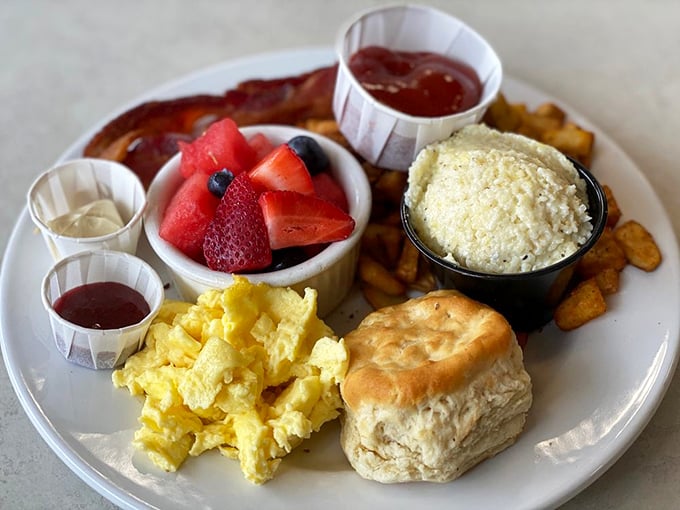 A breakfast sampler that hits all the major food groups: fresh fruit, fluffy eggs, buttery biscuit, and bacon. The breakfast equivalent of winning the lottery.