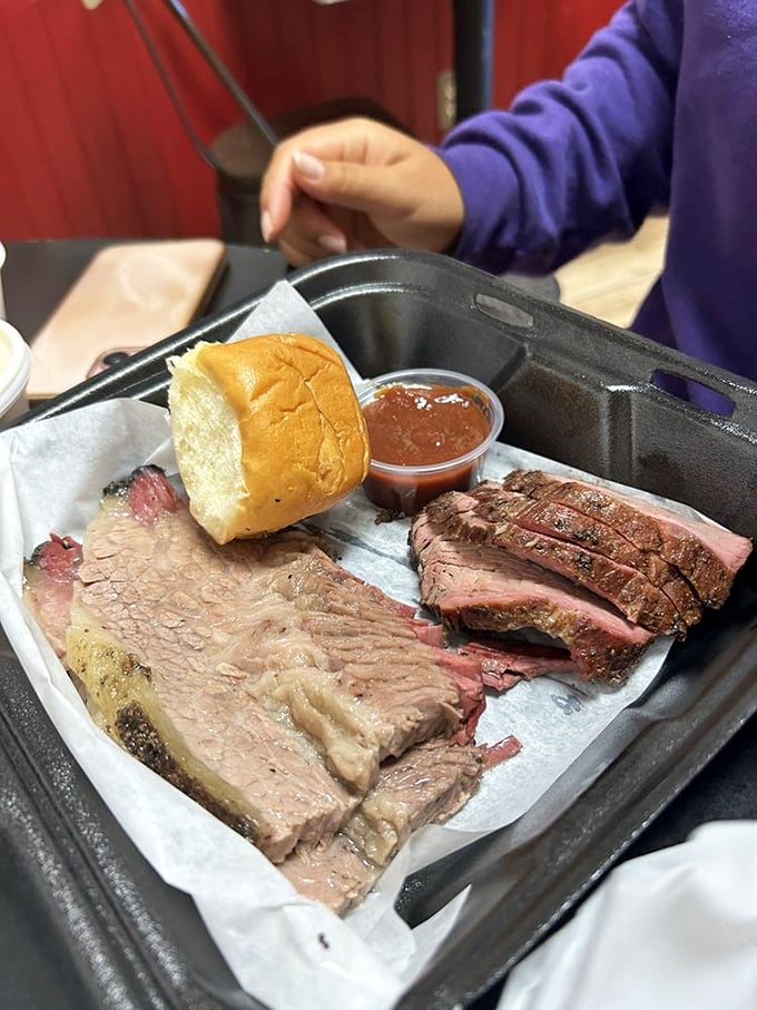 Brisket and sausage living in perfect harmony. The glistening slices of beef alongside that snappy hot link is what barbecue fantasies are made of.