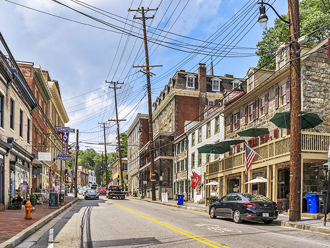 The gentle curve of Main Street reveals a palette of architectural styles, where telephone wires frame a scene straight from a nostalgic postcard.