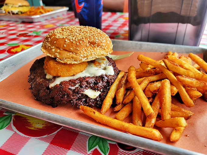 Not just any burger&mdash;this smoke-kissed patty topped with melty cheese demands a two-handed commitment and zero regrets.