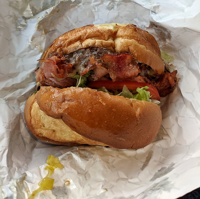 This isn't just a burger; it's an architectural masterpiece of flavor. The foundation is solid, the toppings are inspired, and the taste is unforgettable.