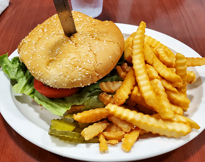 A classic American burger that doesn't need fancy tricks&mdash;just honest ingredients stacked between a sesame seed bun with crispy fries.