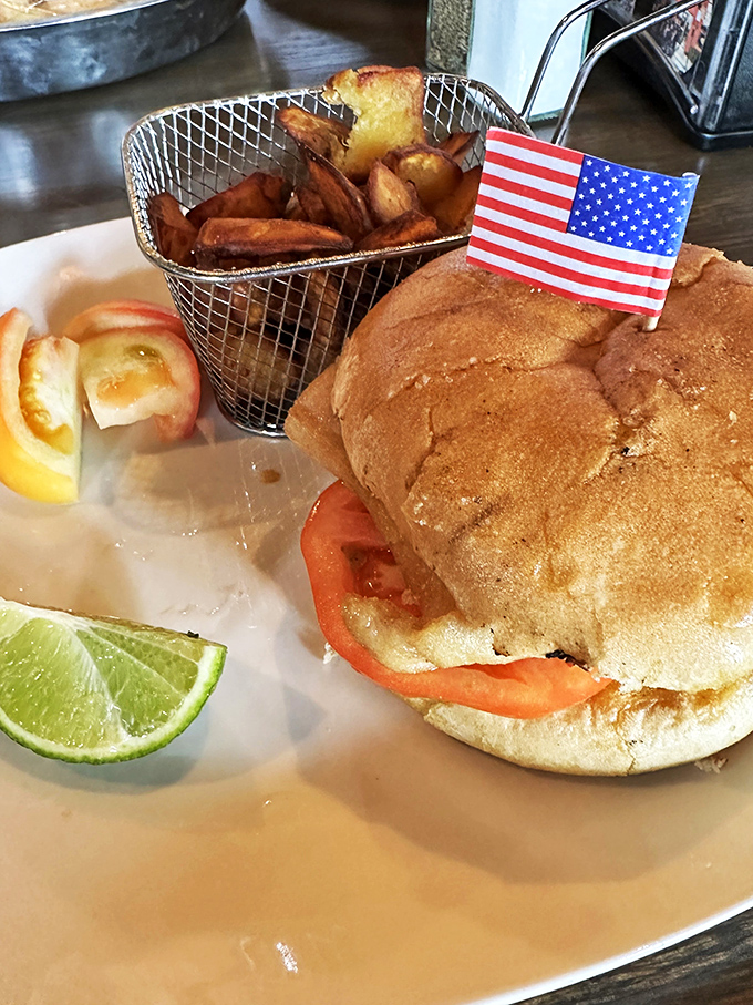 Not in a seafood mood? This sandwich stands tall with American pride, proving landlubbers aren't forgotten at this oceanic outpost.
