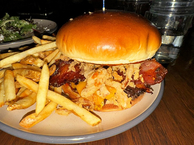 This isn't just a burger&mdash;it's a towering achievement of beef, bacon, and cheese that requires both hands, several napkins, and absolutely no shame.