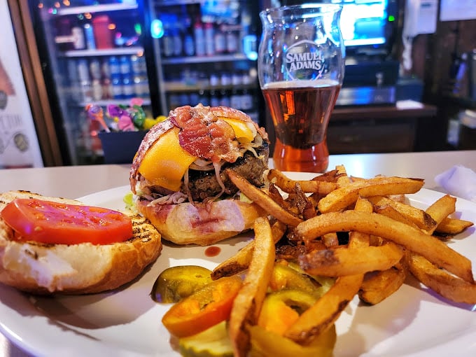 Melted cheese cascading down a perfectly cooked burger patty like lava from a delicious meat volcano. This is why diets were made to be broken. 