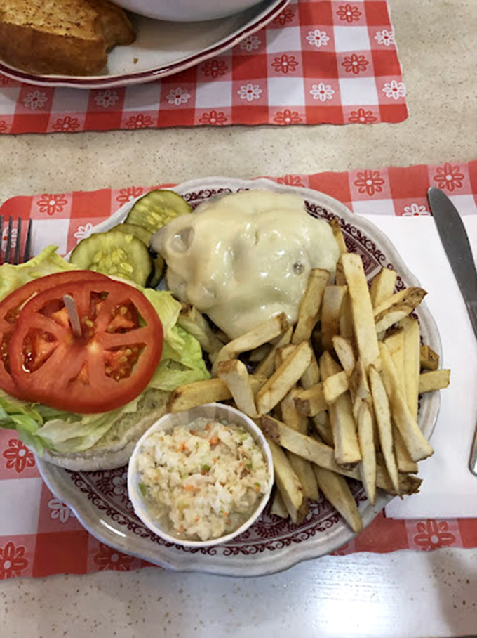 This isn't just a burger&mdash;it's architecture with cheese, where every layer from the melty top to the crisp vegetables creates a symphony of satisfaction. 