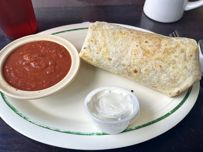 The breakfast burrito arrives like a gift from the morning gods&mdash;a flour tortilla wrapped around eggs, cheese, and savory fillings with a side of house salsa for good measure.