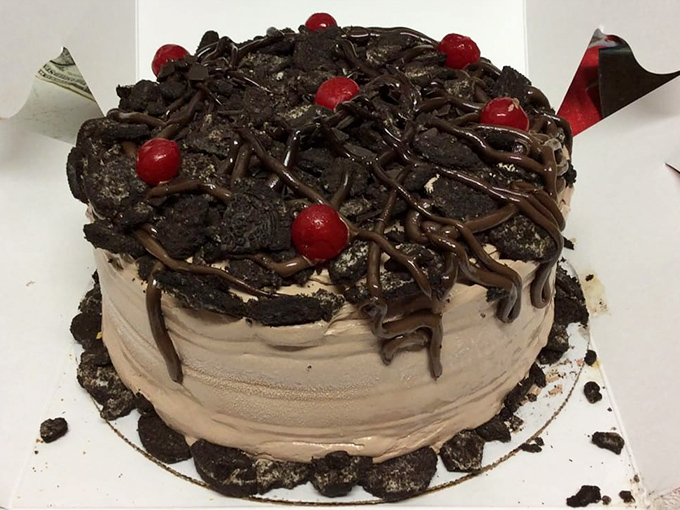 This isn't just dessert—it's a chocolate monument topped with cherries that demands both respect and a fork.