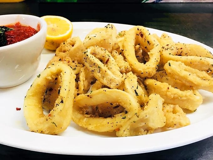 Golden rings of calamari that crunch like autumn leaves, without the yard work. That marinara dipping sauce deserves its own fan club.