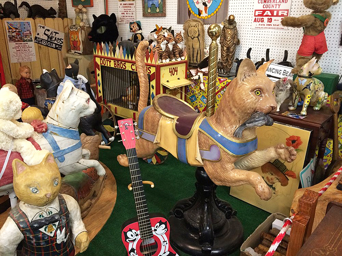 A menagerie of vintage cat toys and figurines creates an eccentric playground that would make Salvador Dalí feel right at home.