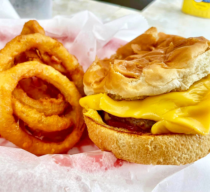The cheeseburger and onion rings combo that makes you question all other food decisions you've ever made. That melty cheese is practically winking at you.