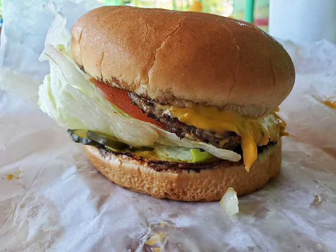 Behold the cheeseburger in its natural habitat&mdash;unpretentious, perfectly melted cheese, fresh veggies. No Instagram filter required for this beauty.
