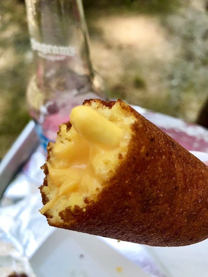 The cross-section reveals the holy grail of corn dogs &ndash; that perfect ratio of crispy exterior to molten cheese core that dreams are made of.