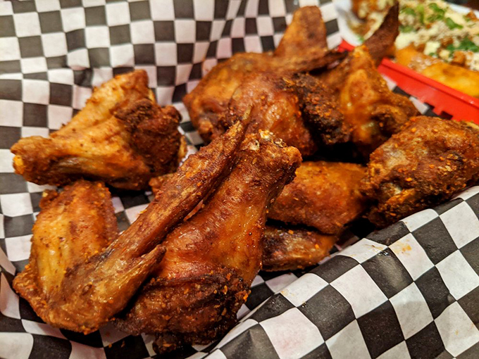 These wings have the kind of deep mahogany color that whispers "I've been smoked with patience and love" before shouting "EAT ME NOW!"