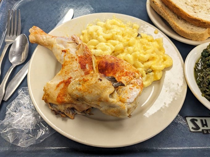 Southern grandmothers would approve of this chicken plate. Mac and cheese so golden it could qualify as currency in certain comfort food-loving circles.