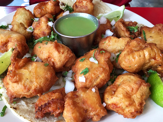 This isn't just fried fish on a tortilla&mdash;it's edible joy. The green sauce adds bright acidity that cuts through richness with surgical precision.