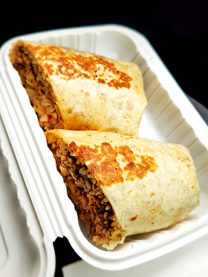 Some burritos are merely lunch; this one's a revelation. The golden-brown sear marks are nature's way of saying "you've made an excellent decision today."