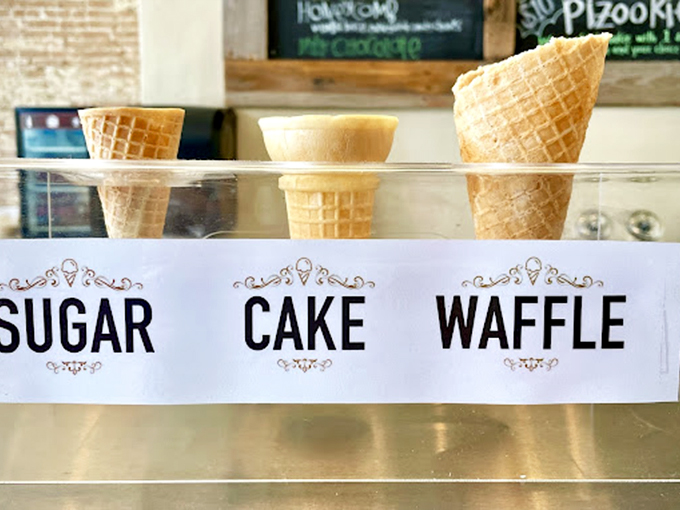 Sugar, cake, or waffle? The holy trinity of cone options stands ready for duty, each promising a different textural journey. 