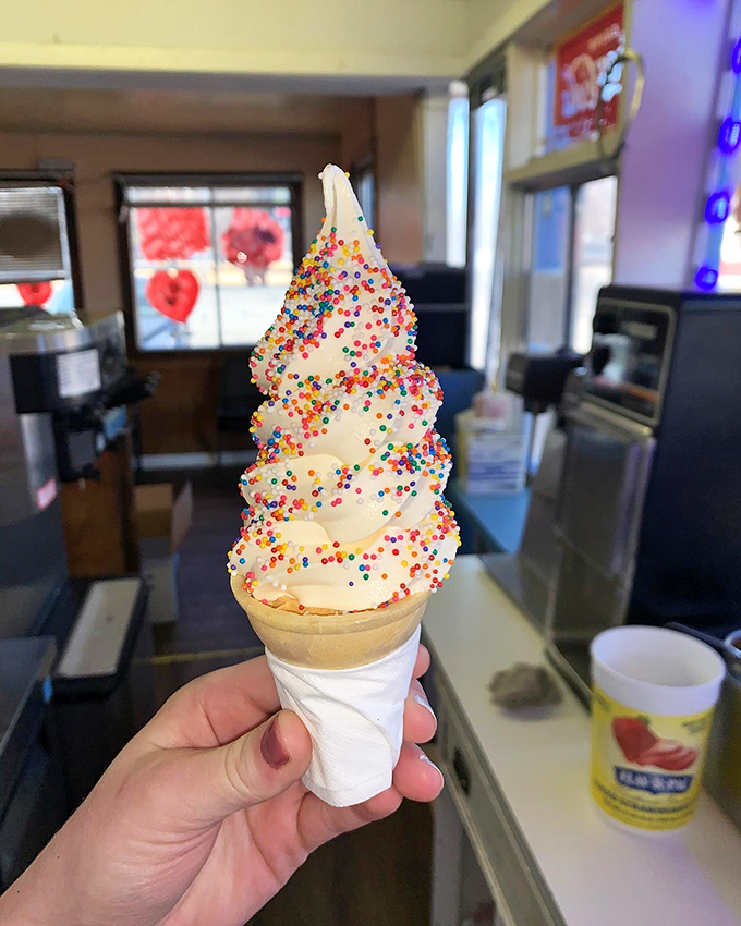 Sprinkles aren't just for kids! This vanilla cone with rainbow jimmies is joy incarnate, no matter your age.