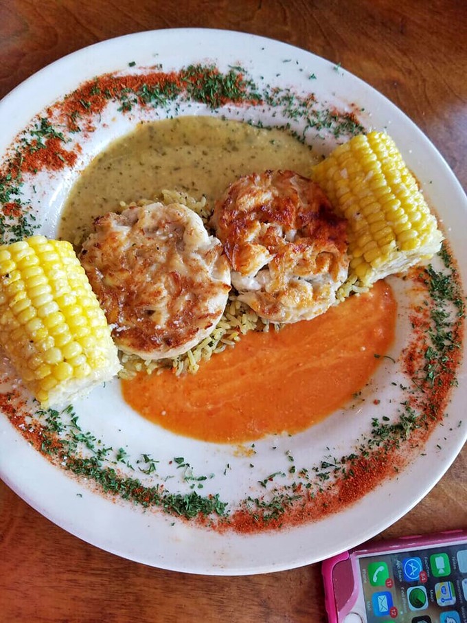 The plate says it all: two perfect rounds of mostly-crab-barely-filler glory, presented like the culinary medals they deserve to be.