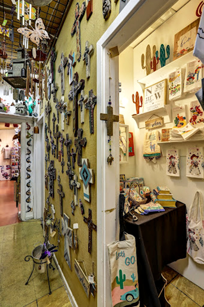 A wall devoted to artistic crosses represents the Southwest's rich cultural heritage, displaying craftsmanship that transforms spiritual symbols into works of art.