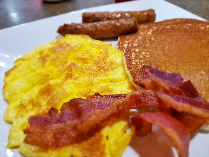 These eggs look like they were whispered into existence by a chef who understands that breakfast is the most sacred meal of the day.