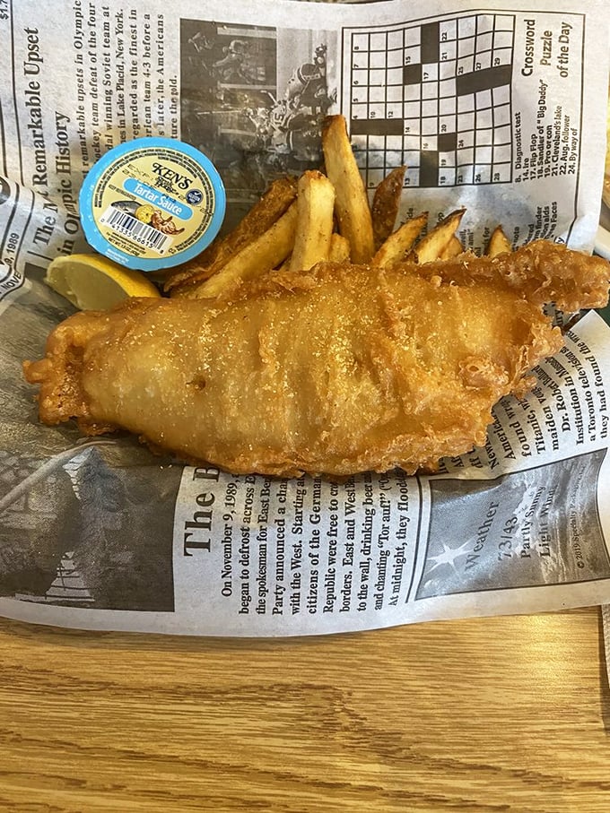 Fish and chips done proper, mate! Crispy batter, flaky white fish, and chips thick enough to make the Queen nod in approval.