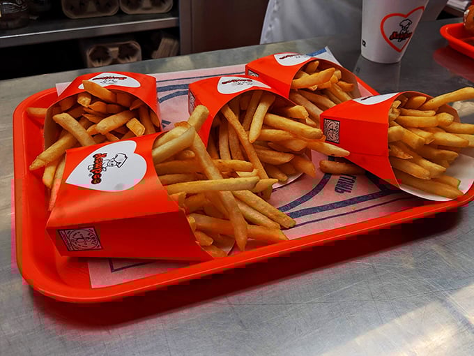 Golden fries nestled in their paper cocoons&mdash;the perfect supporting actors in the burger drama unfolding on your tray.