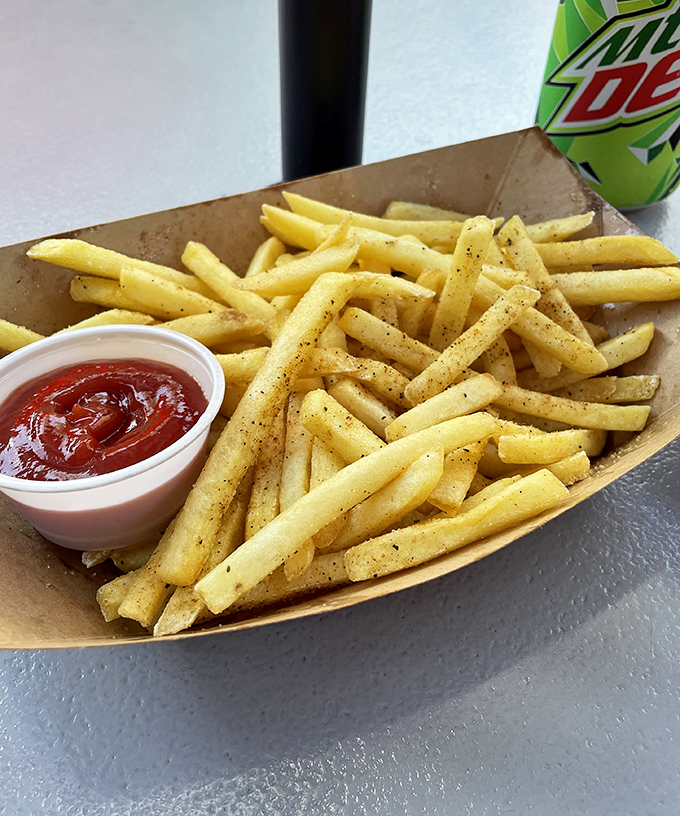 Golden, crispy fries dusted with seasoning that makes your fingers worth licking. The perfect supporting actor to the hot dog's starring role.