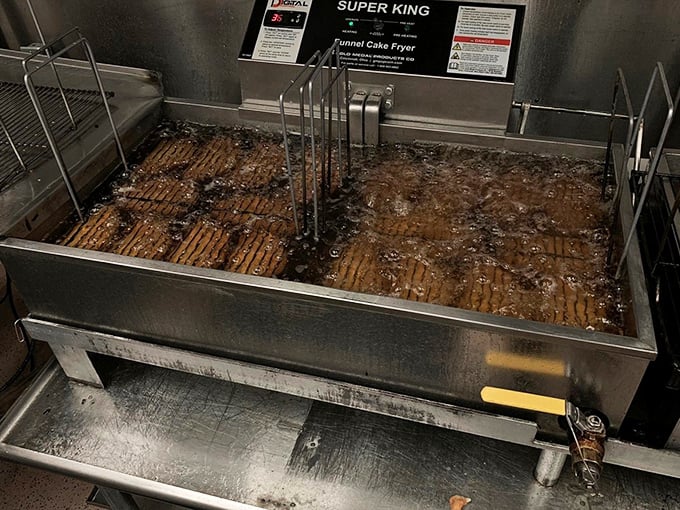 The bubbling cauldron where magic happens. Like watching Willy Wonka's factory in action, these golden pockets transform from dough to dream.