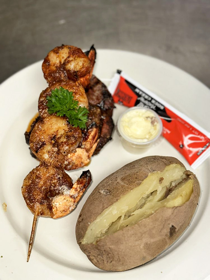 Perfectly wood-fired shrimp skewers paired with a classic baked potato. Like finding a parking spot right in front&mdash;simple pleasures executed flawlessly.