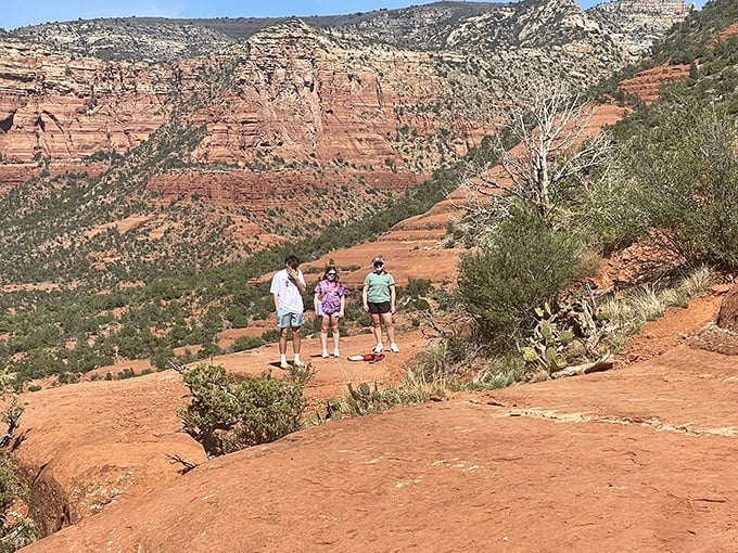 Three hikers pausing to absorb the magnitude of it all. Sometimes the best part of hiking is simply standing still.