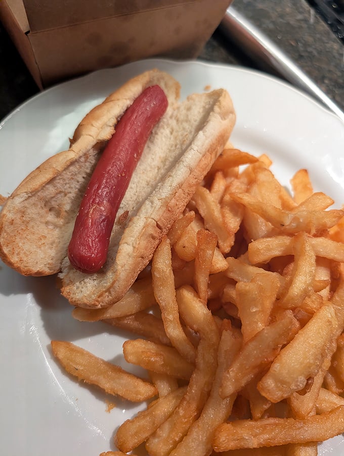 Even the hot dog gets the royal treatment, nestled in a soft bun alongside a mountain of perfectly crisp fries.