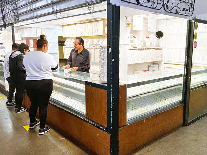 Jewelry shopping becomes a cultural exchange at this glass-fronted stall where customers chat with vendors about their sparkling wares. 
