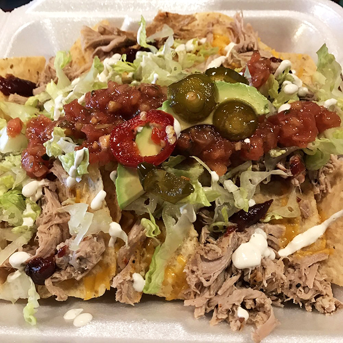 These loaded nachos aren't just a snack, they're a celebration where every bite delivers a perfect harmony of savory meat, fresh veggies, and creamy sauce.