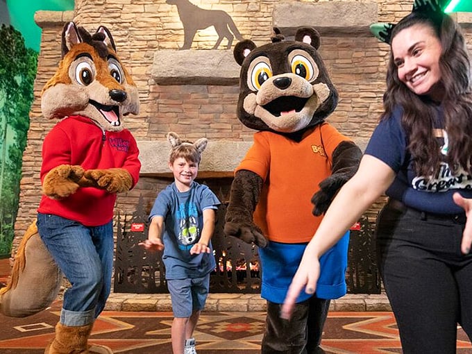 The lodge mascots: friendlier than your average woodland creatures and significantly less likely to raid your campsite. Those high-fives are worth the chlorine smell.