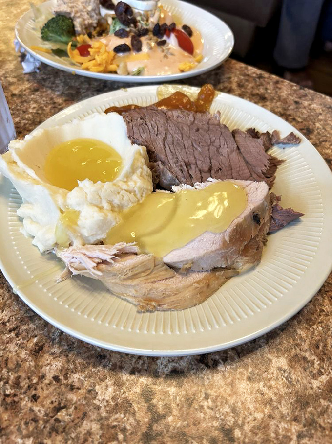 The holy trinity of heartland dining: perfectly cooked roast beef, cloud-like mashed potatoes, and a medley of beans that would make any grandmother nod in approval.